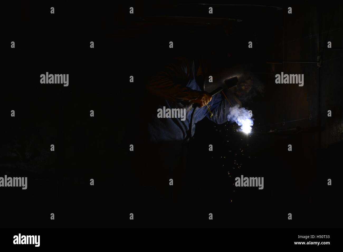 Welder in action. Series Stock Photo - Alamy