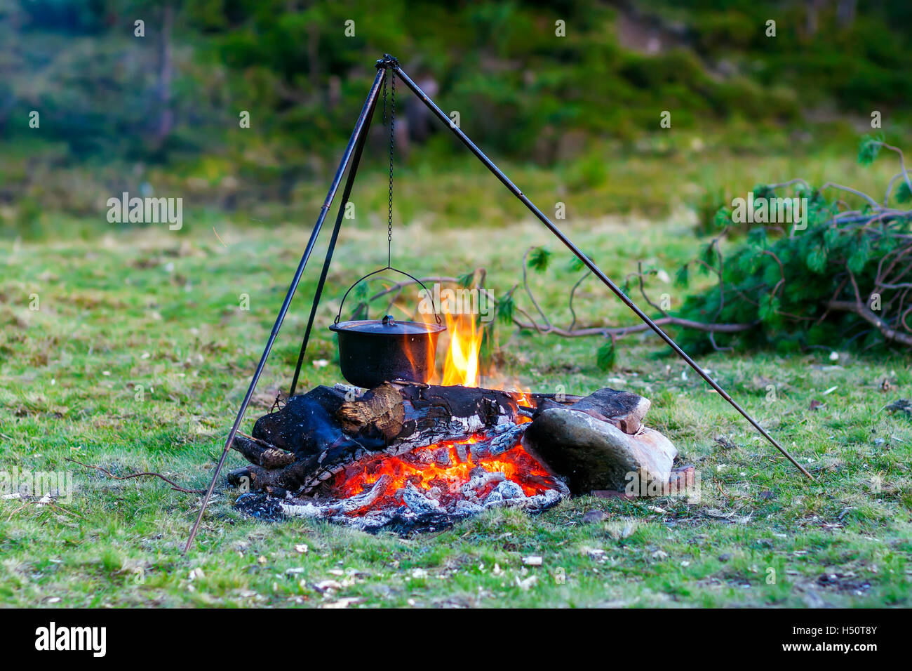 Camping kitchenware - pot on the fire at an outdoor campsite Stock ...