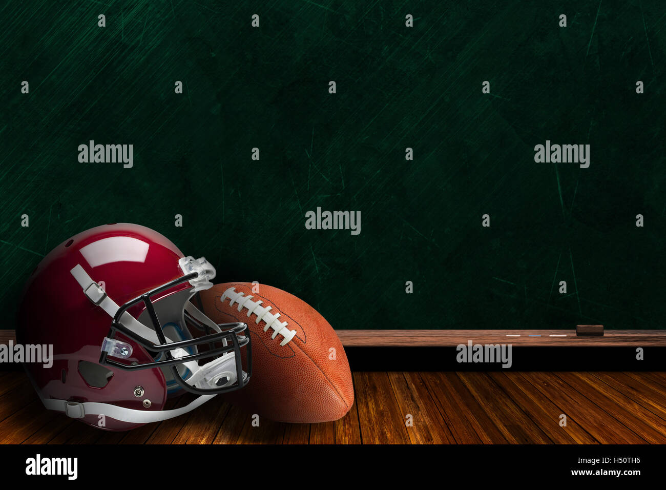Football helmet and ball on a background chalk board with copy space ...