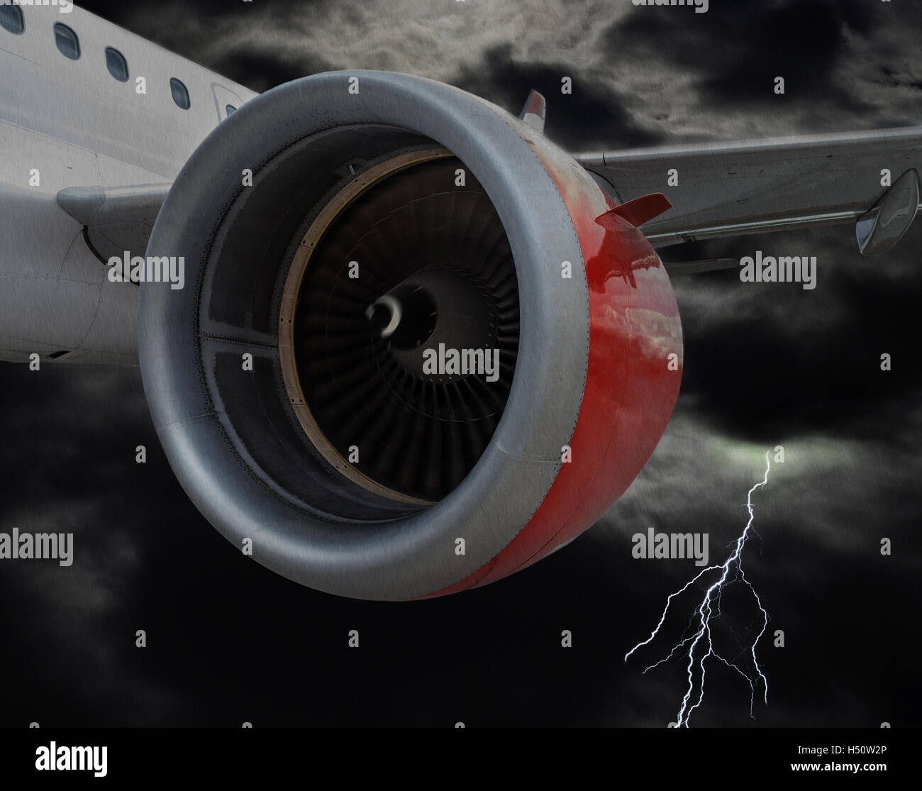 Commercial airplane with red engine in flight through stormy rain ...