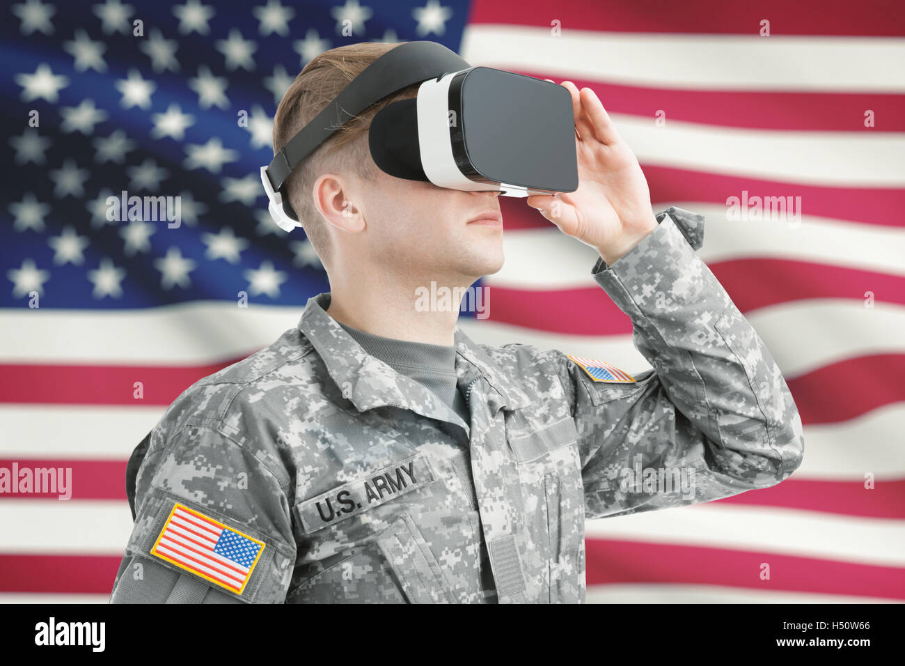 Indoors shot of USA soldier wearing virtual reality glasses with ...