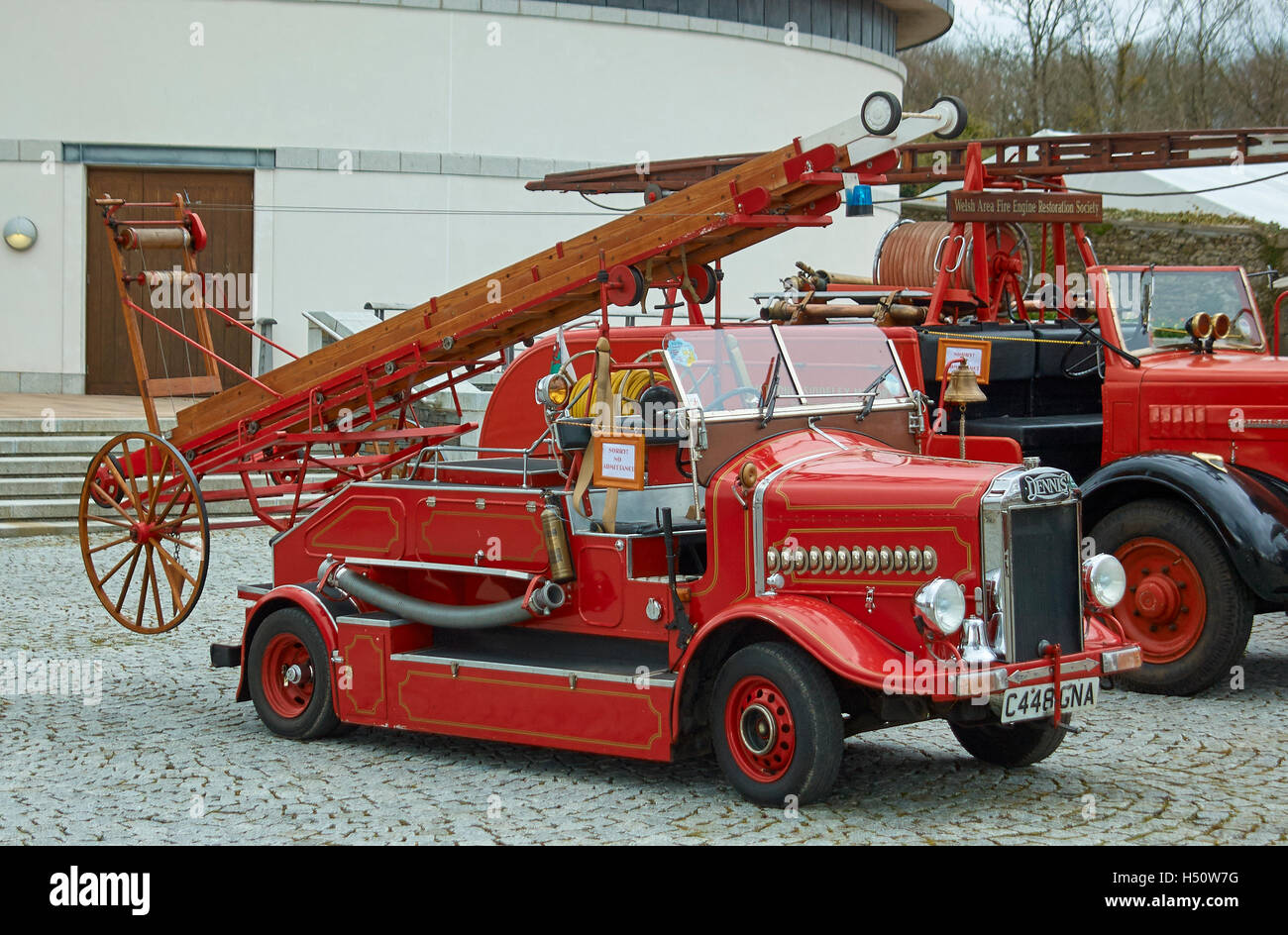 Old Dennis Fire Engine with a traditional wheeled retractable pump ...