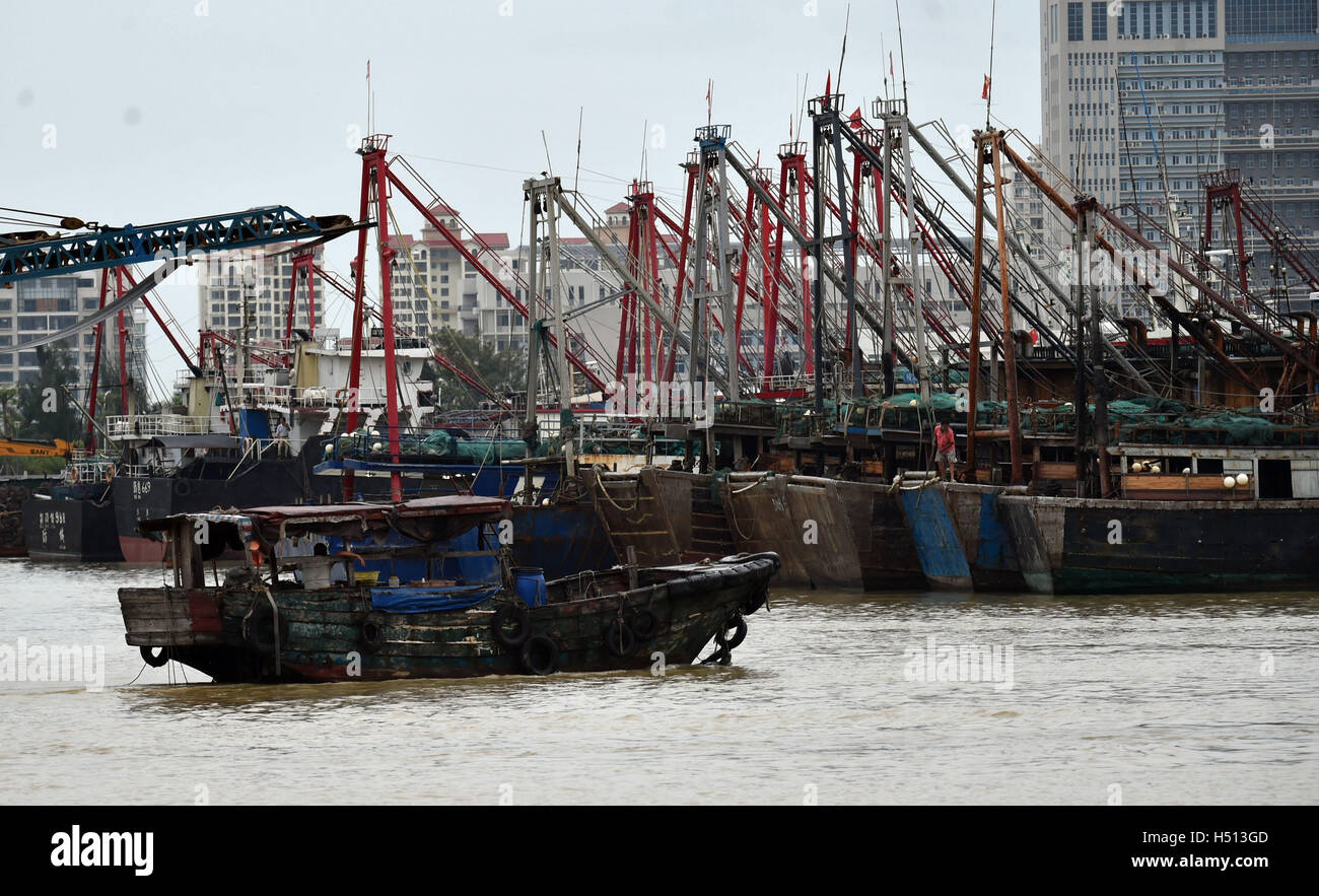 Haikou, Hainan Province. 19th Oct, 2016. A fishing boat leaves a ...
