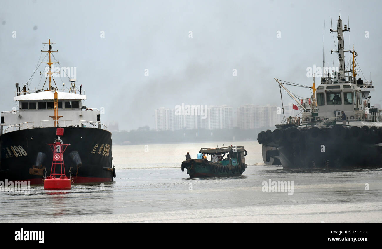Haikou, Hainan Province. 19th Oct, 2016. A fishing boat leaves a ...