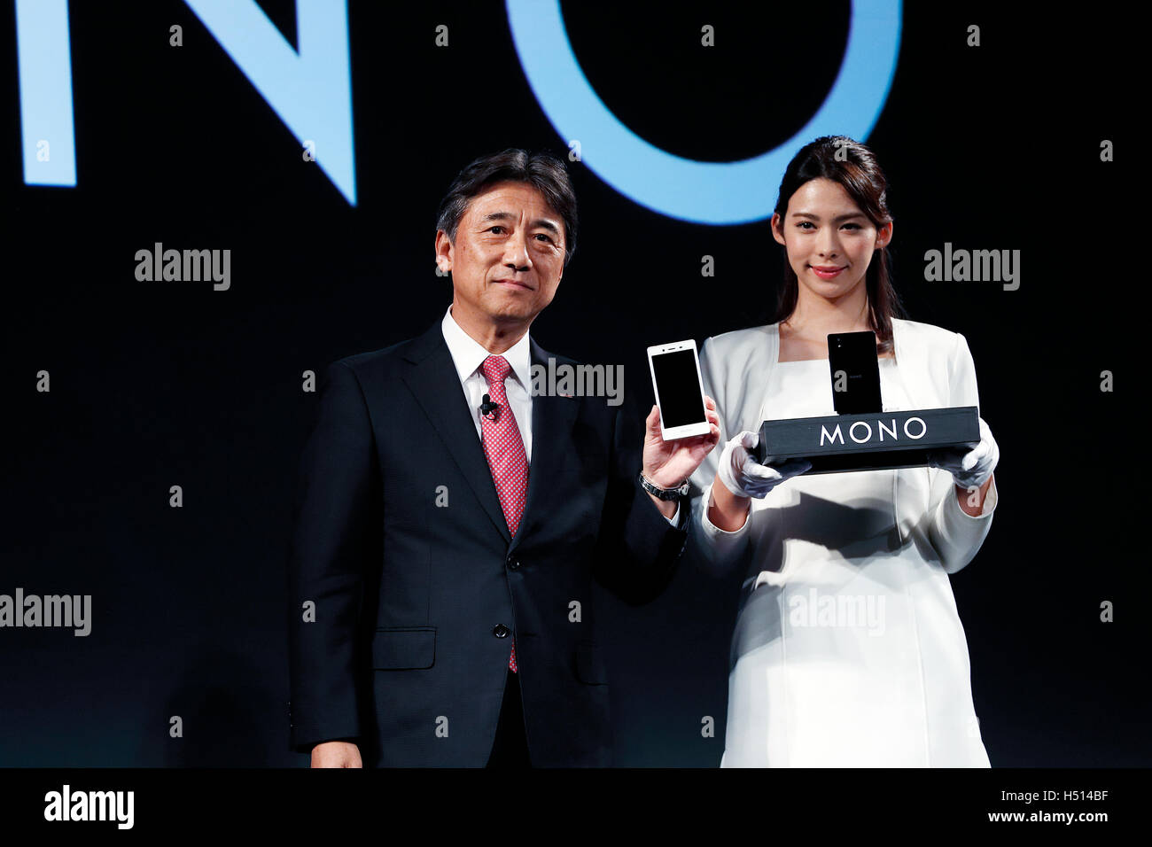 NTT DoCoMo President Kazuhiro Yoshizawa shows their new original ...