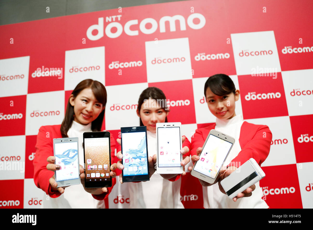 Models show new smartphones during the launch of DoCoMo's 2016-2017 ...
