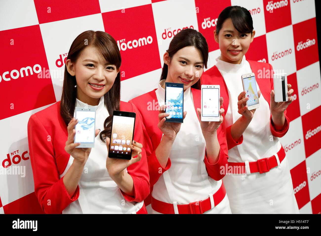 Models show new smartphones during the launch of DoCoMo's 2016-2017 ...