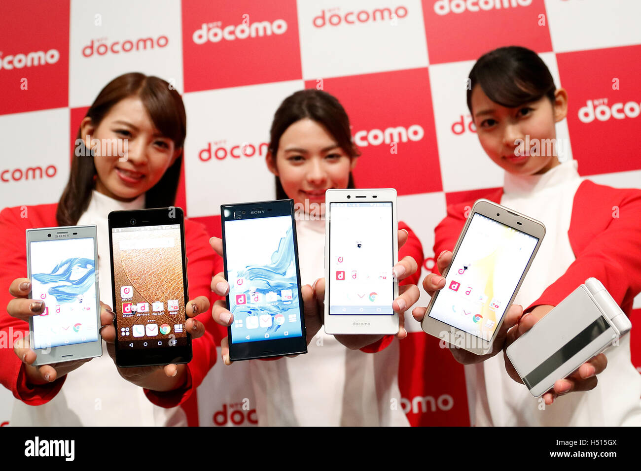 Models show new smartphones during the launch of DoCoMo's 2016-2017 ...