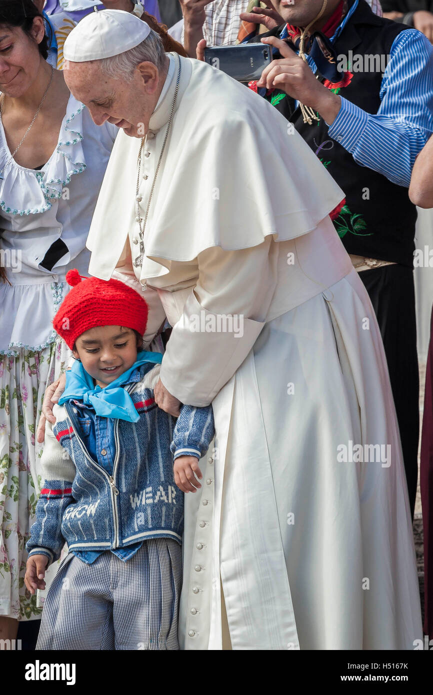 Vatican City, Vatican. 19th October, 2016. Pope Francis hugs a child ...