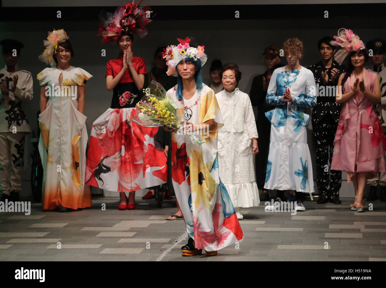 Tokyo, Japan. 19th Oct, 2016. Japanese designer Takafumi Tsuruta (C ...