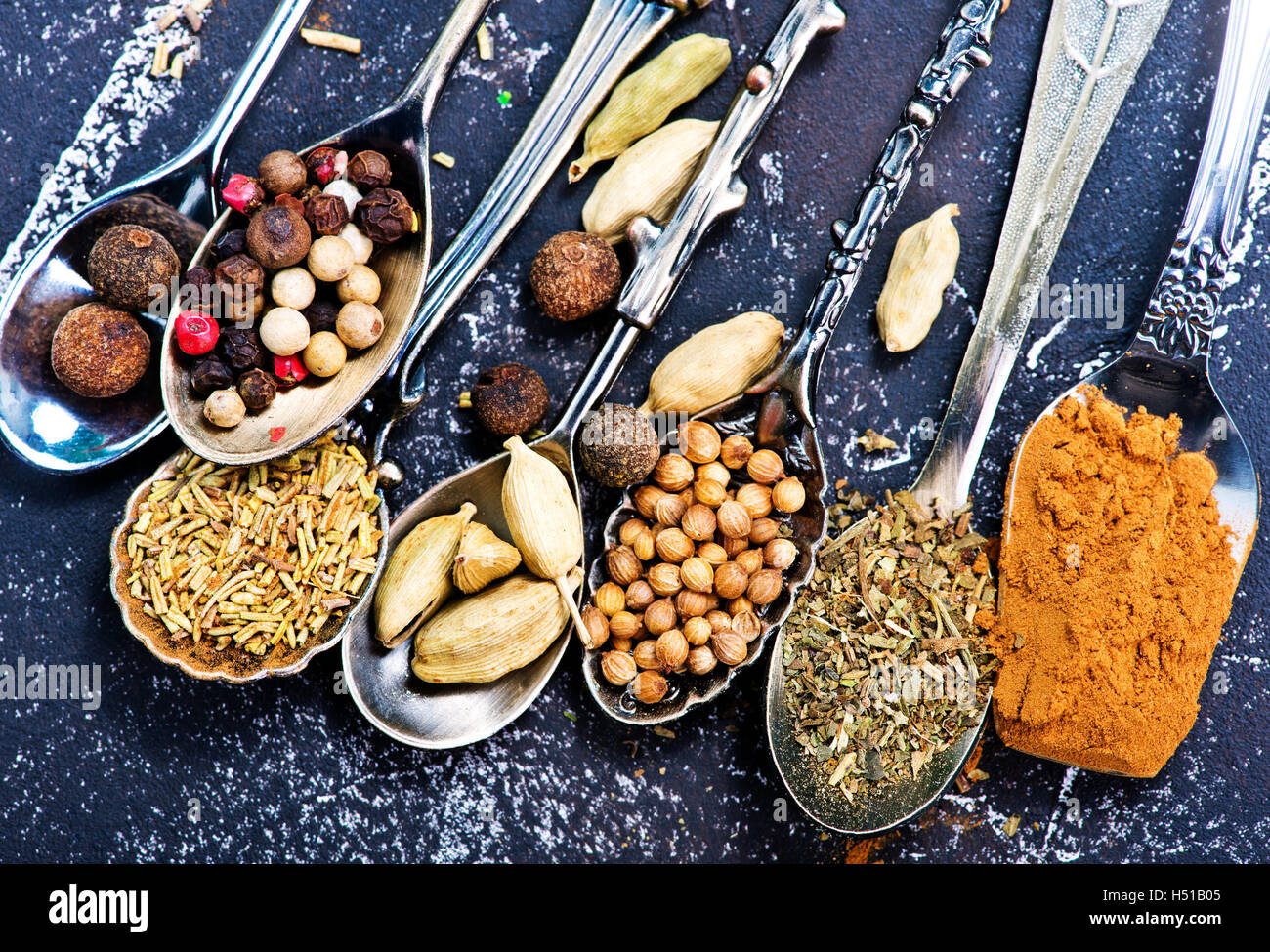 aroma spice and dry herbs on the black table Stock Photo - Alamy