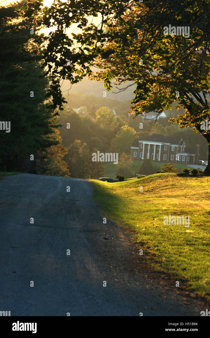 Mansion seen from driveway at sunset Stock Photo - Alamy