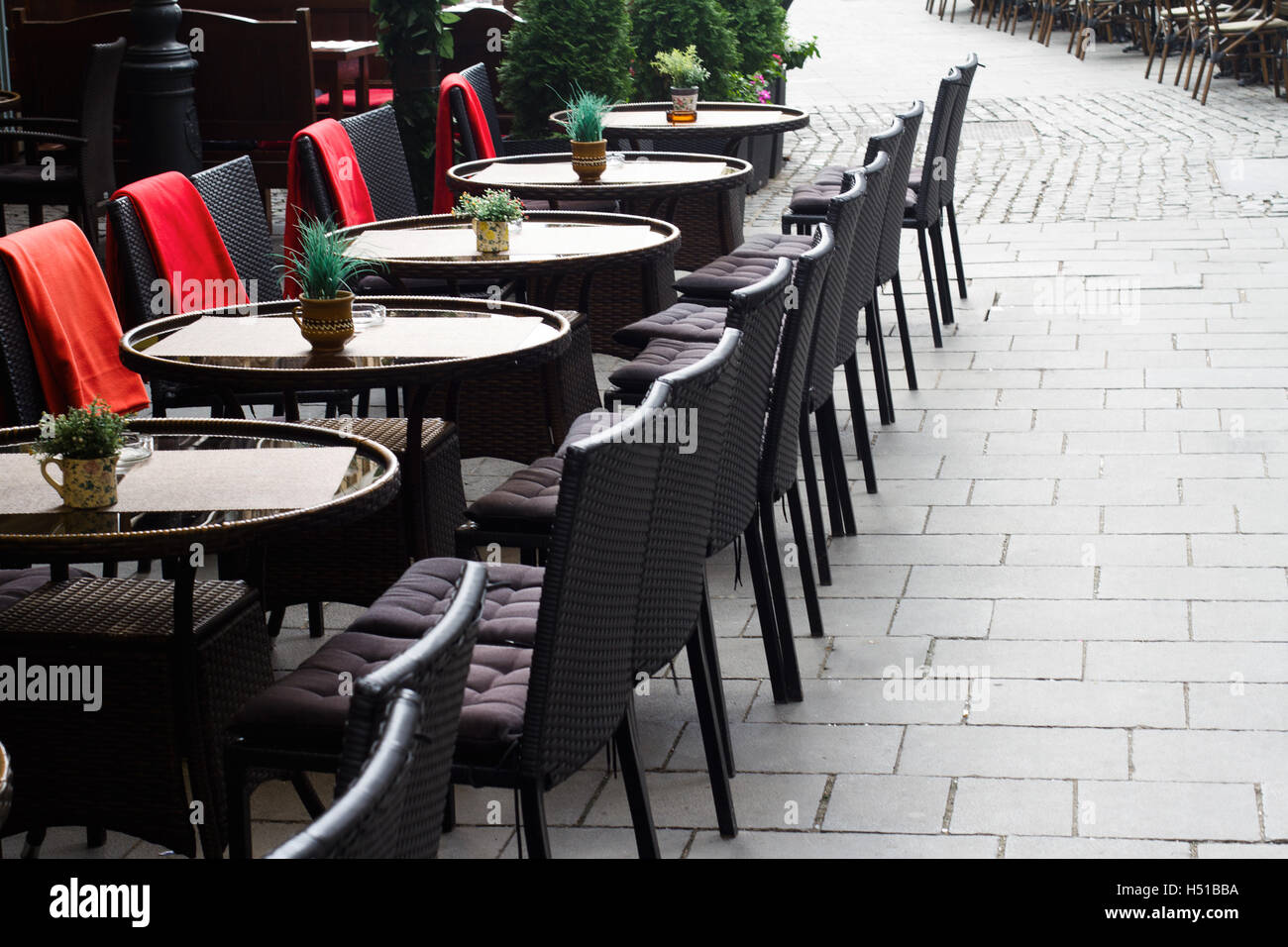 Horizontal perspective view of dining tables and chairs in front of the ...