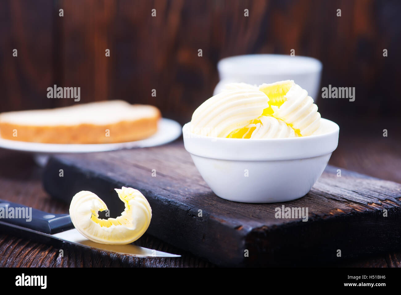 butter on plate and on a table Stock Photo - Alamy