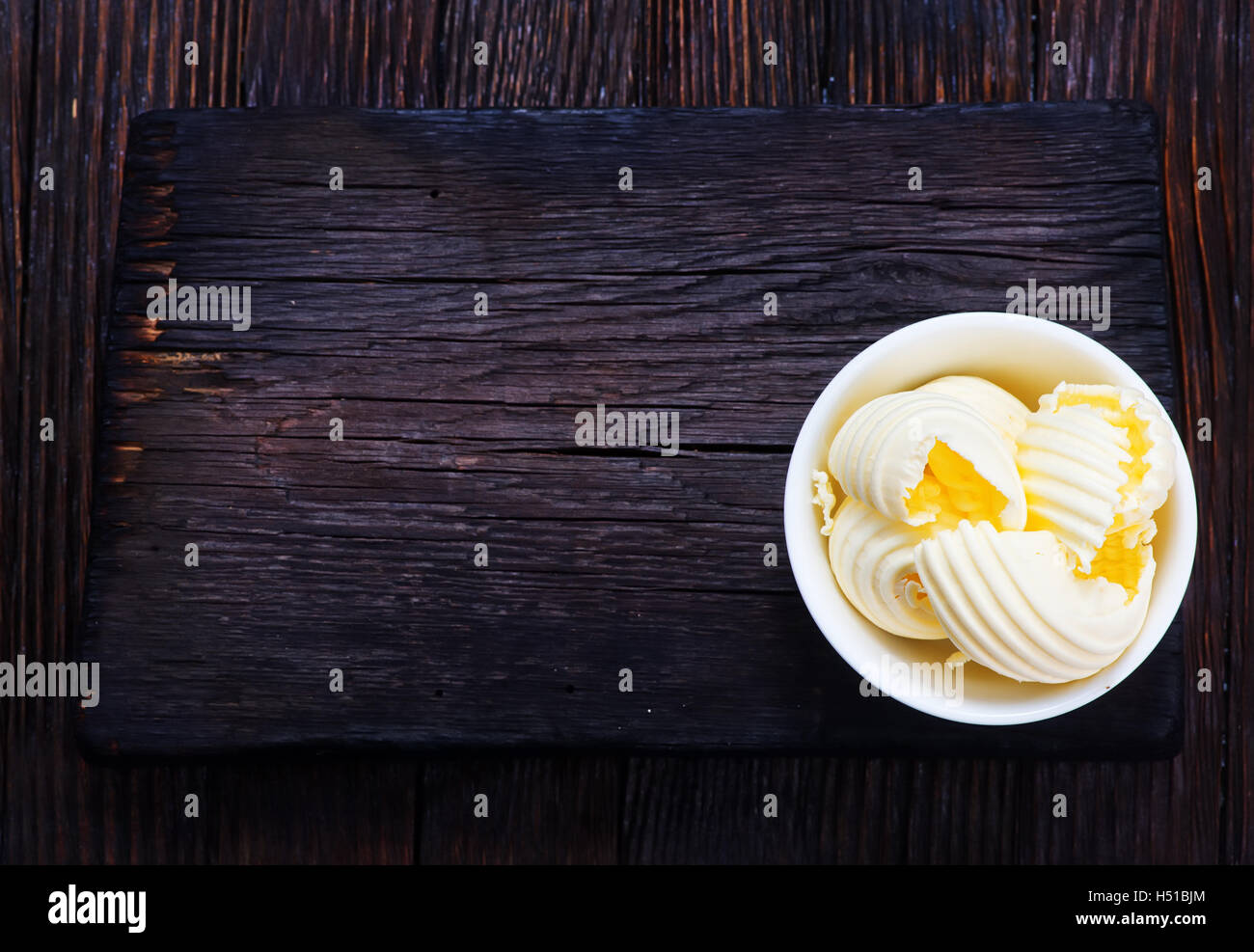 butter on plate and on a table Stock Photo - Alamy