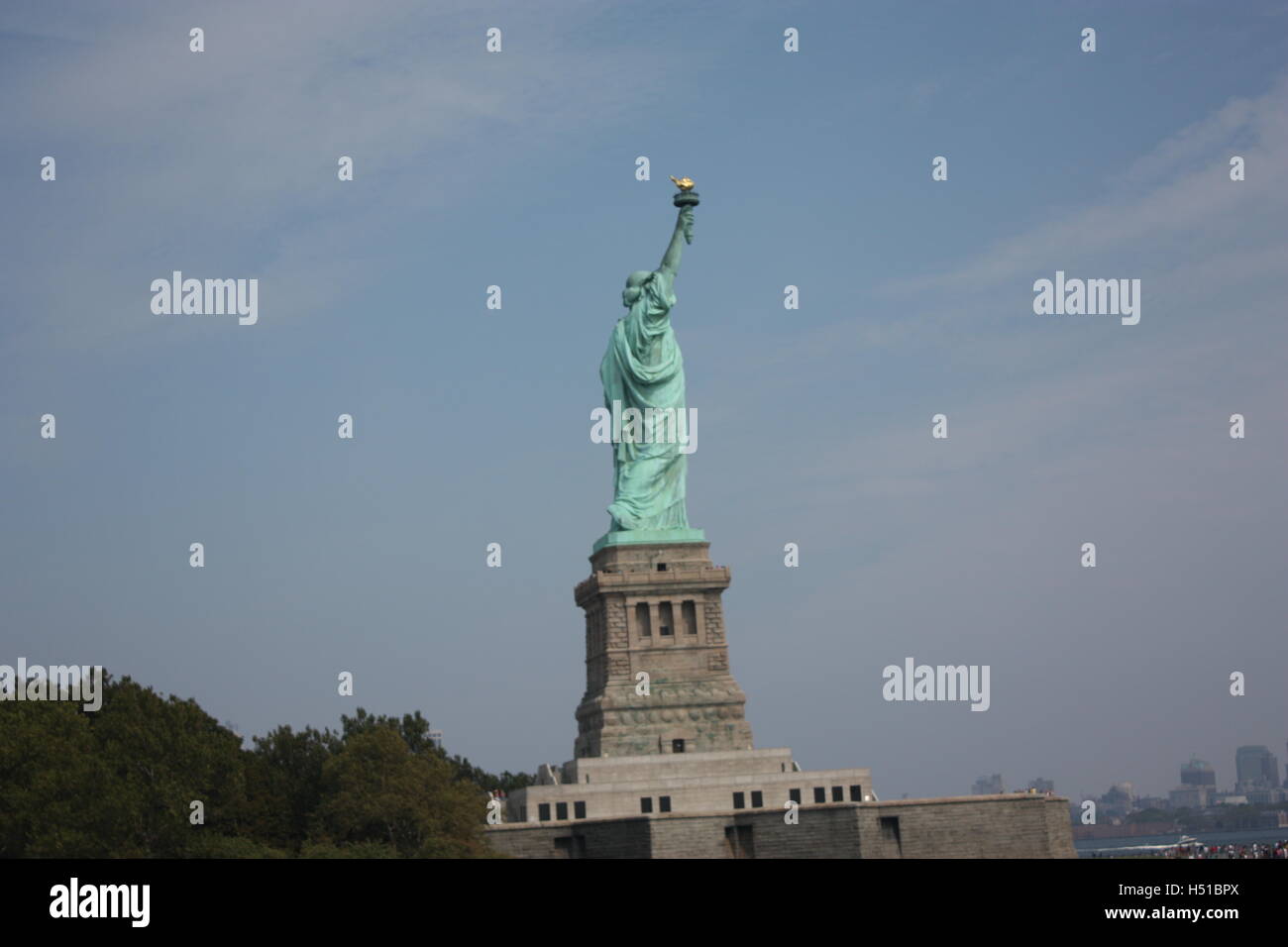 Statue of Liberty from behind in New York Stock Photo - Alamy