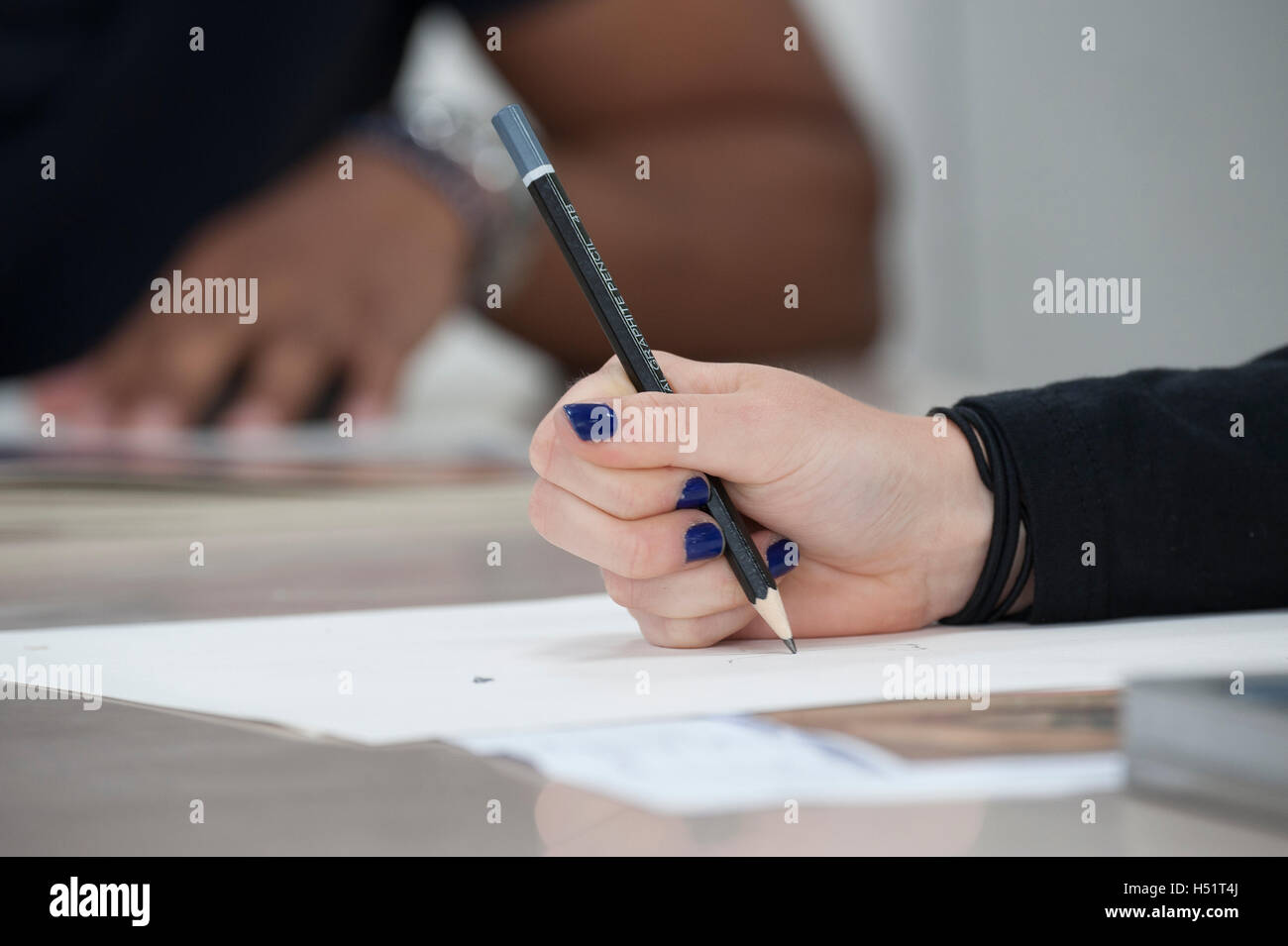 Hand holding pencil hi-res stock photography and images - Alamy