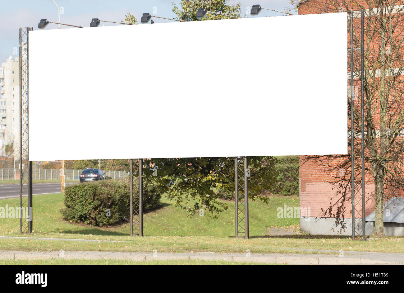 Large blank billboard near the road with city view background Stock ...