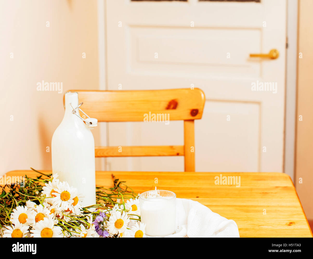 Simply stylish wooden kitchen with bottle of milk and glass on t Stock ...