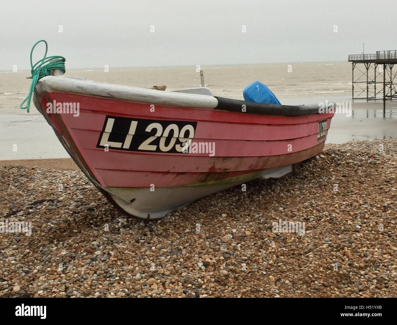 beached fishing boat Stock Photo - Alamy