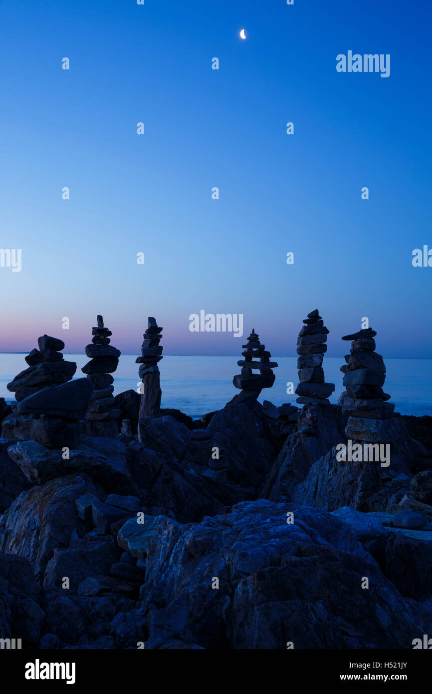 Rock stacks at sunrise in Rye, New Hampshire USA during the spring ...