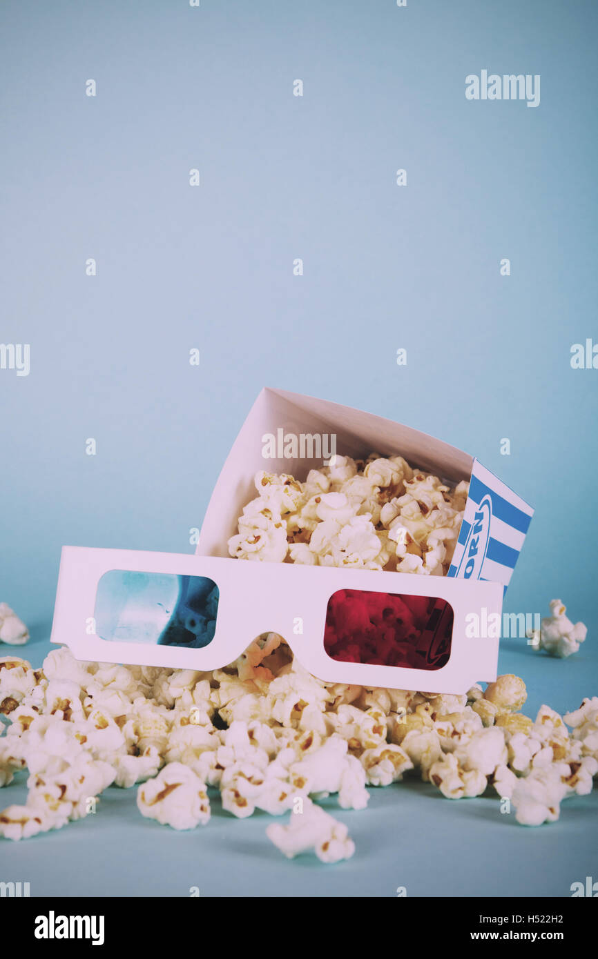 Bucket of popcorn against a blue background Vintage Retro Filter Stock ...
