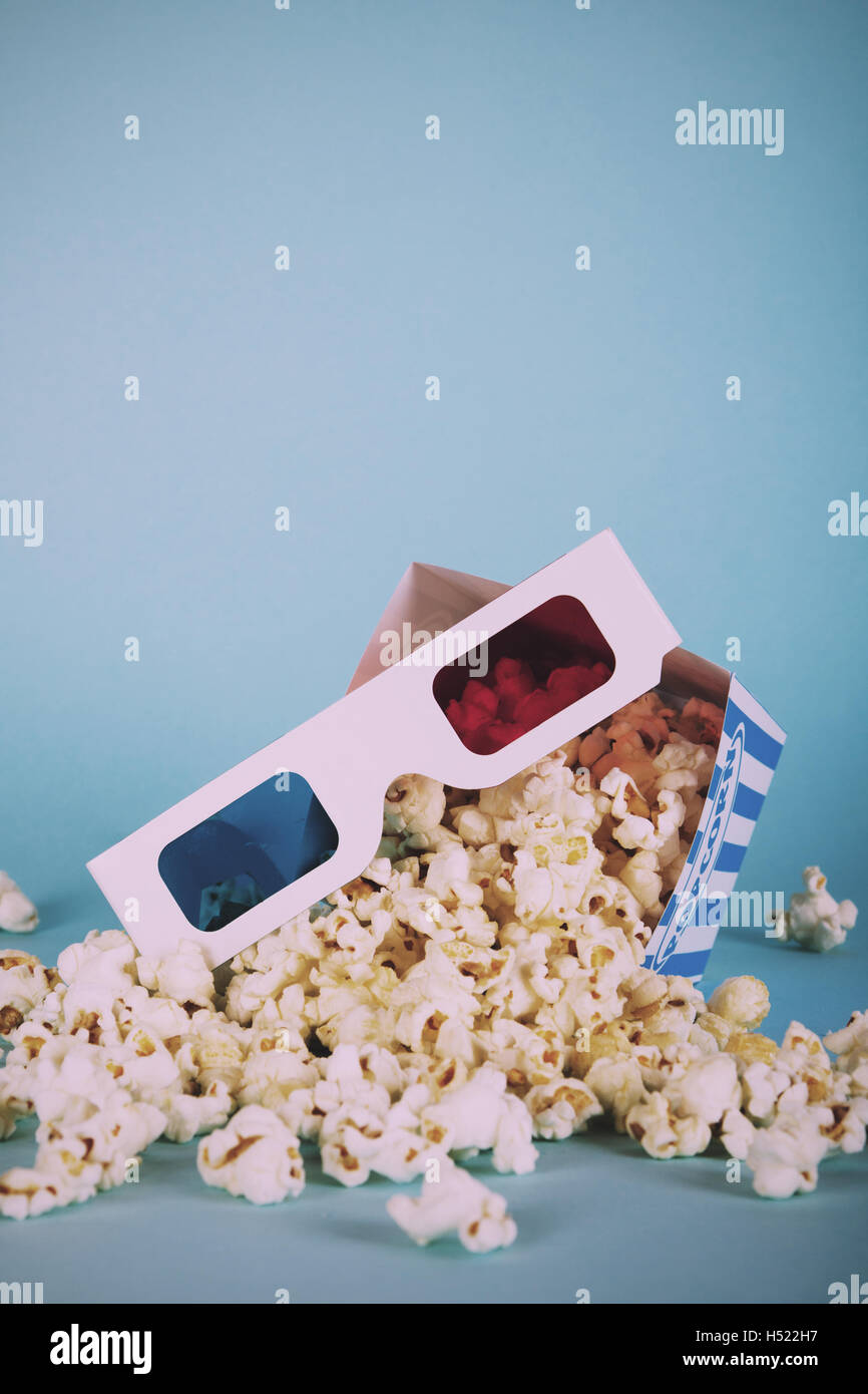 Bucket of popcorn against a blue background Vintage Retro Filter Stock ...