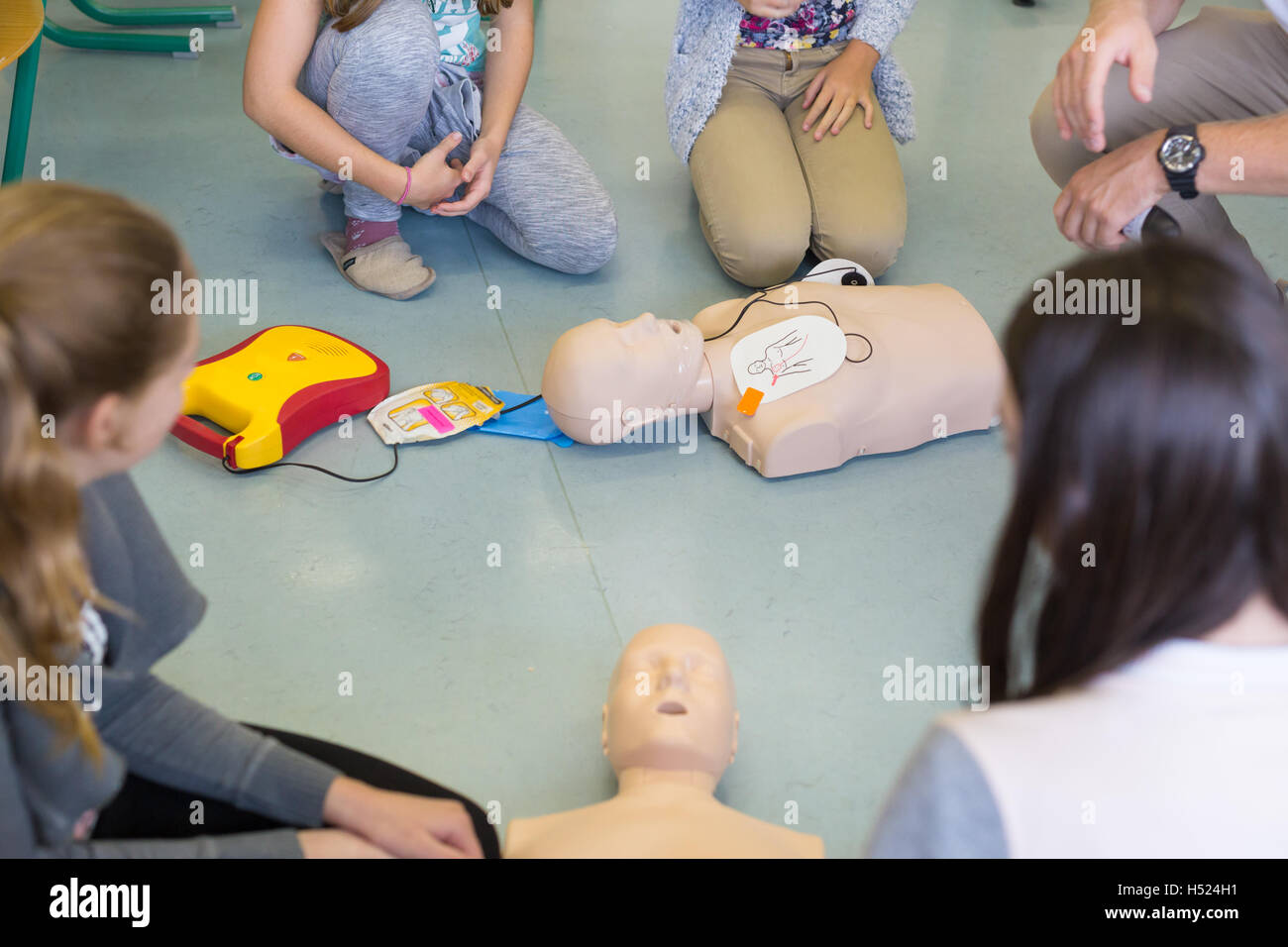School Children With Resuscitation Doll High Resolution Stock ...
