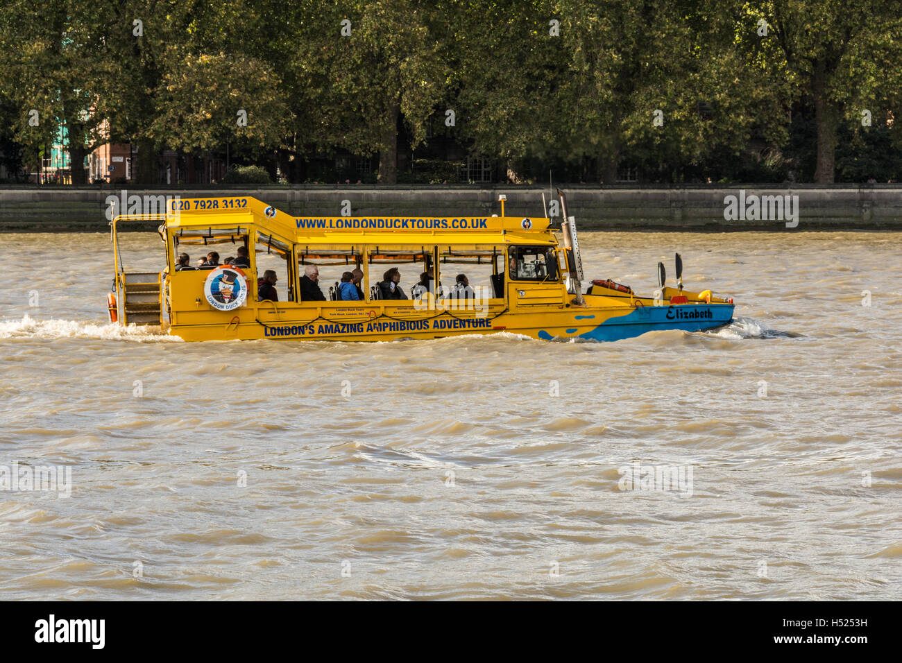 A heavily laden and low-in-the-water London Duck Tours bus on the River ...