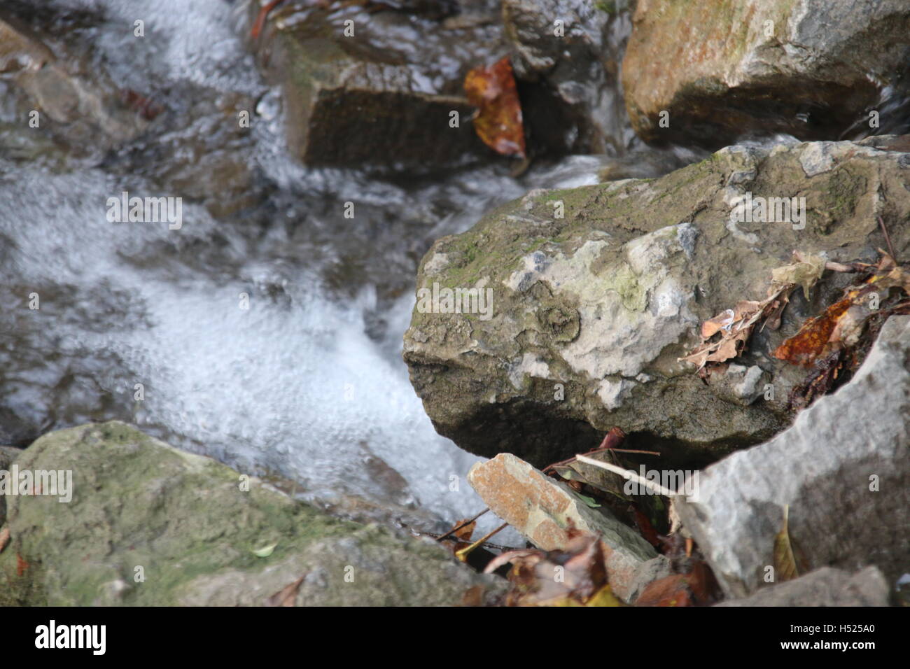 Water flowing over rocks Stock Photo - Alamy