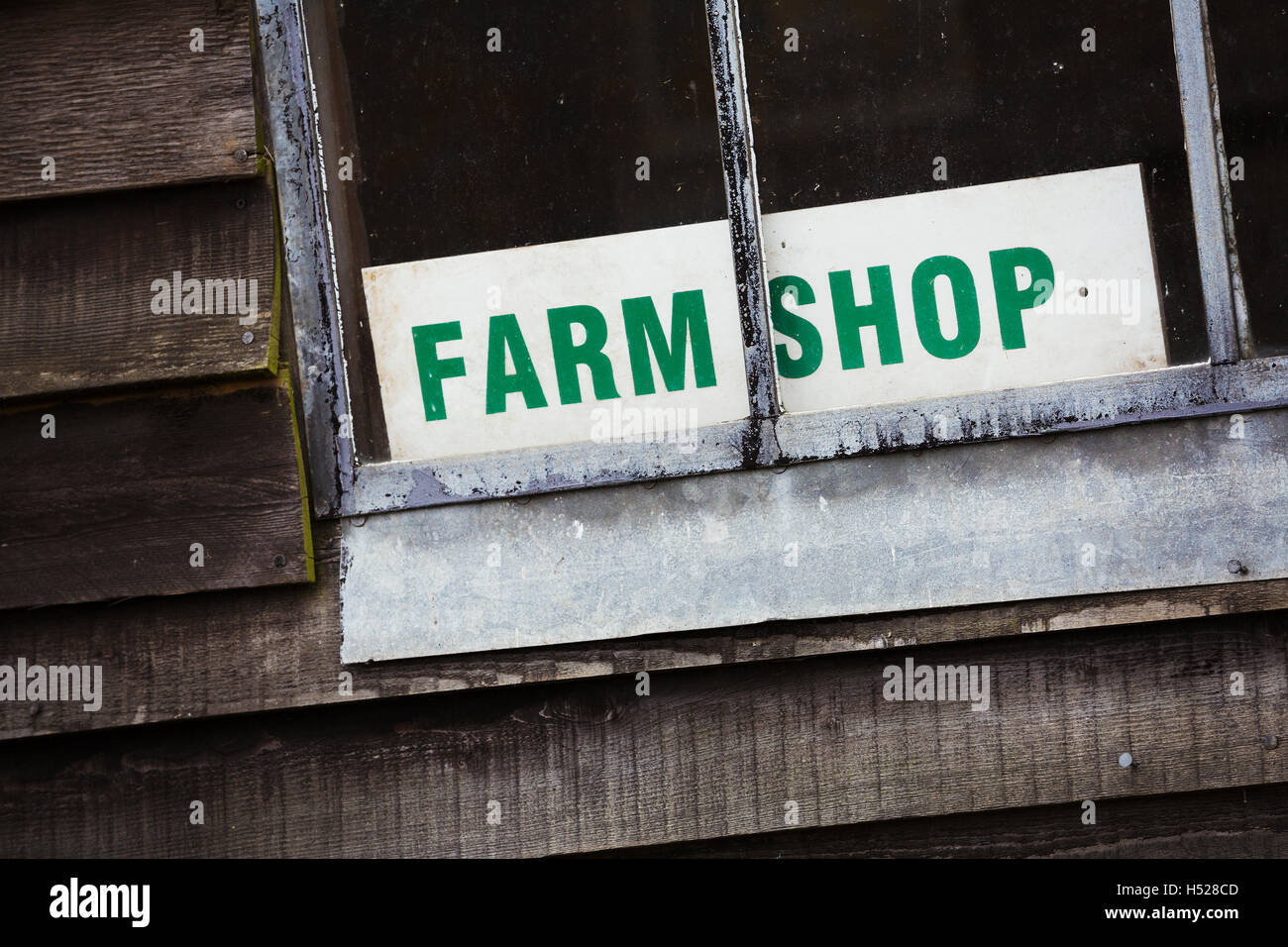 A sign for a farm shop visible through a window Stock Photo - Alamy