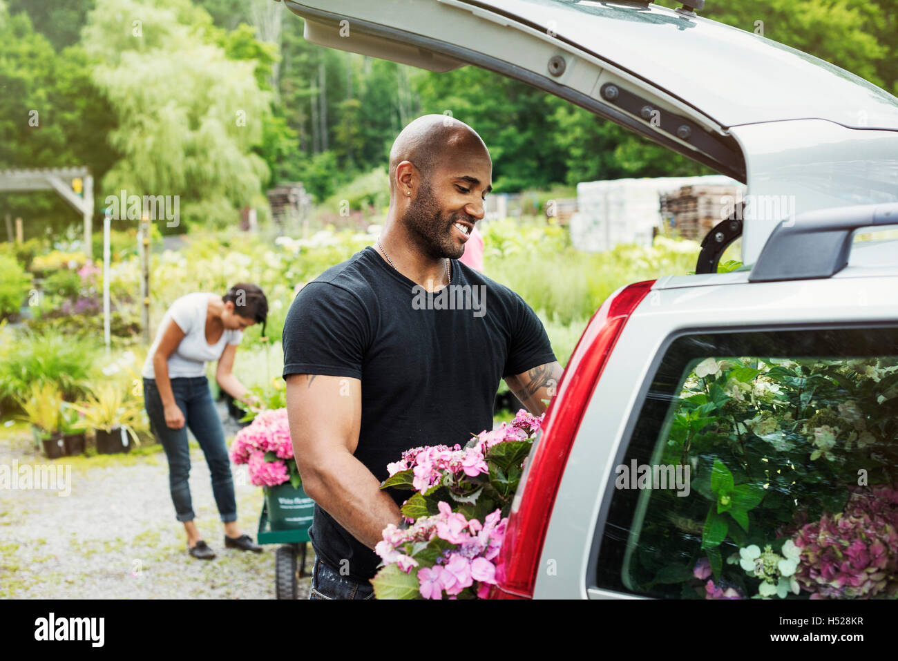 Man loading flowers hi-res stock photography and images - Alamy
