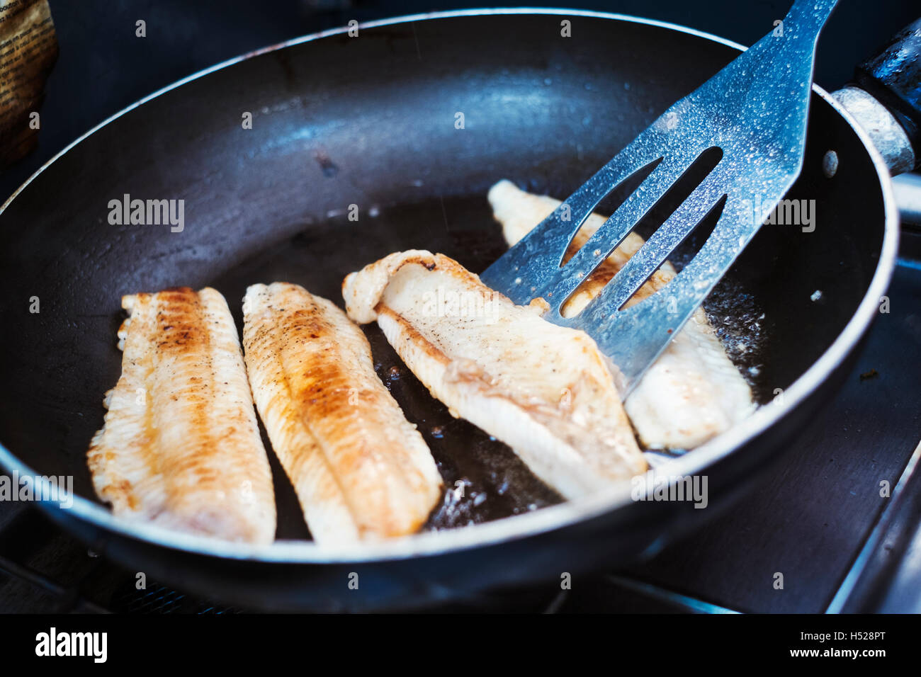 Pan fried fish hi-res stock photography and images - Alamy