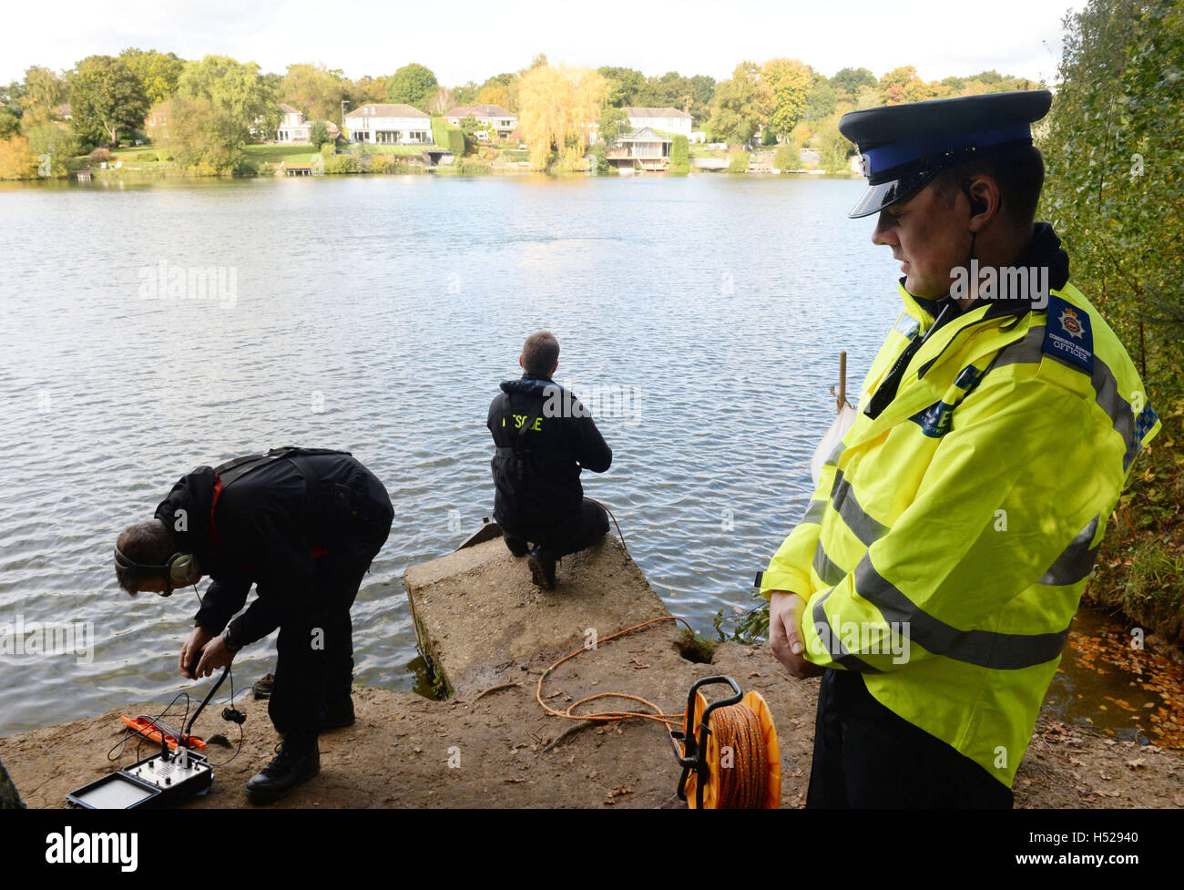 A specialist diving team searches Littleheath Pond in Oxshott, Surrey ...