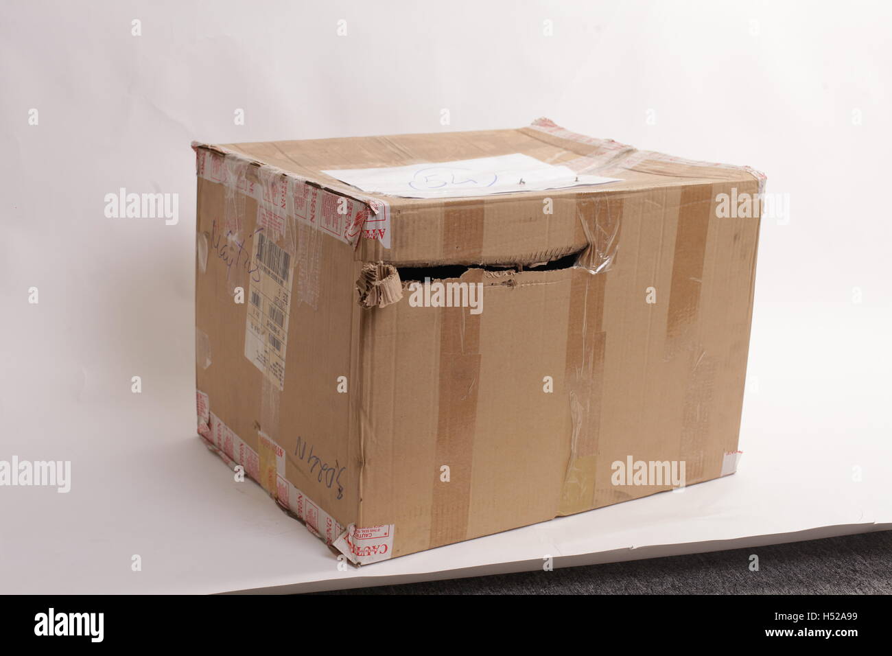 Fragile box damaged isolated on white Stock Photo - Alamy