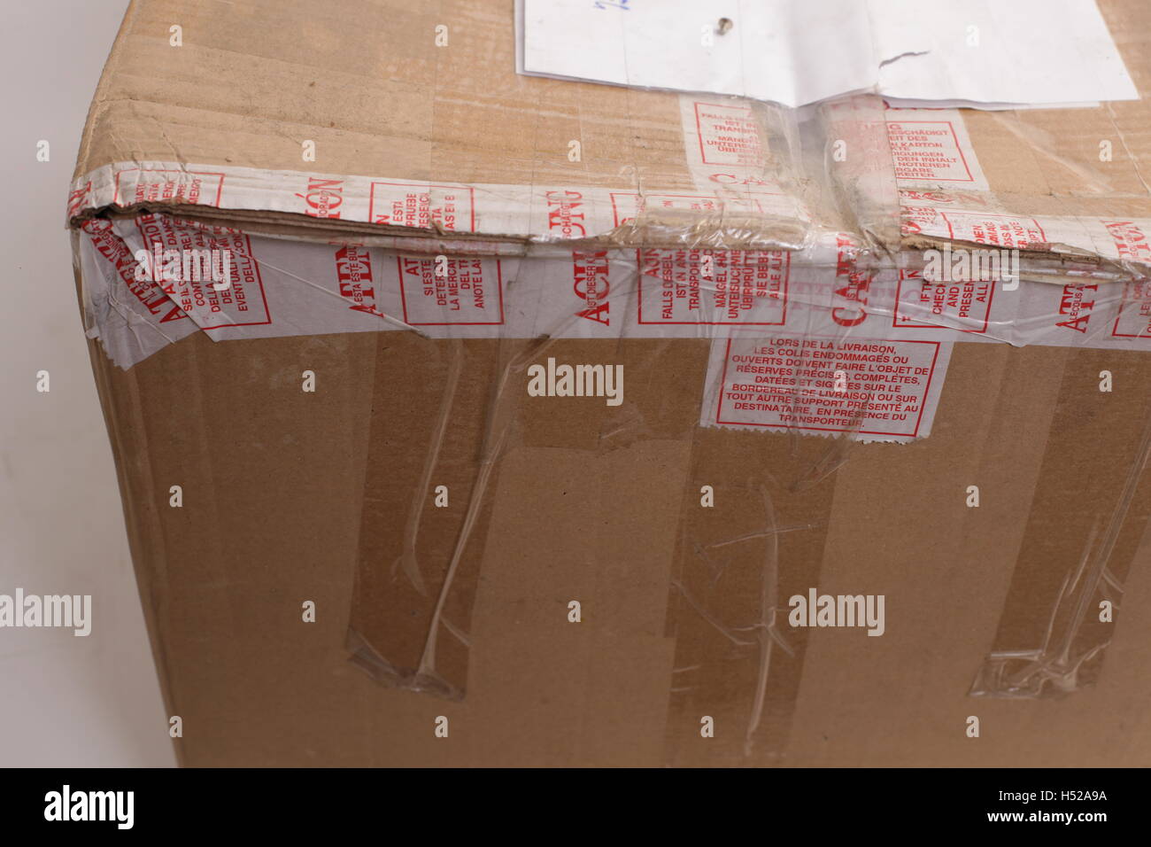 Fragile box damaged isolated on white Stock Photo - Alamy