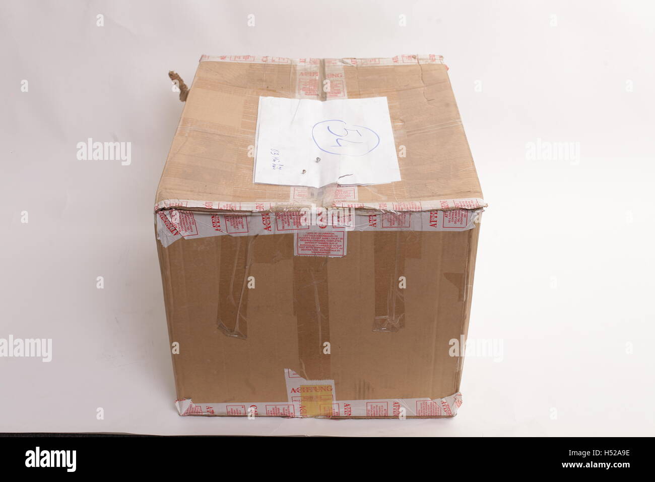 Fragile box damaged isolated on white Stock Photo - Alamy