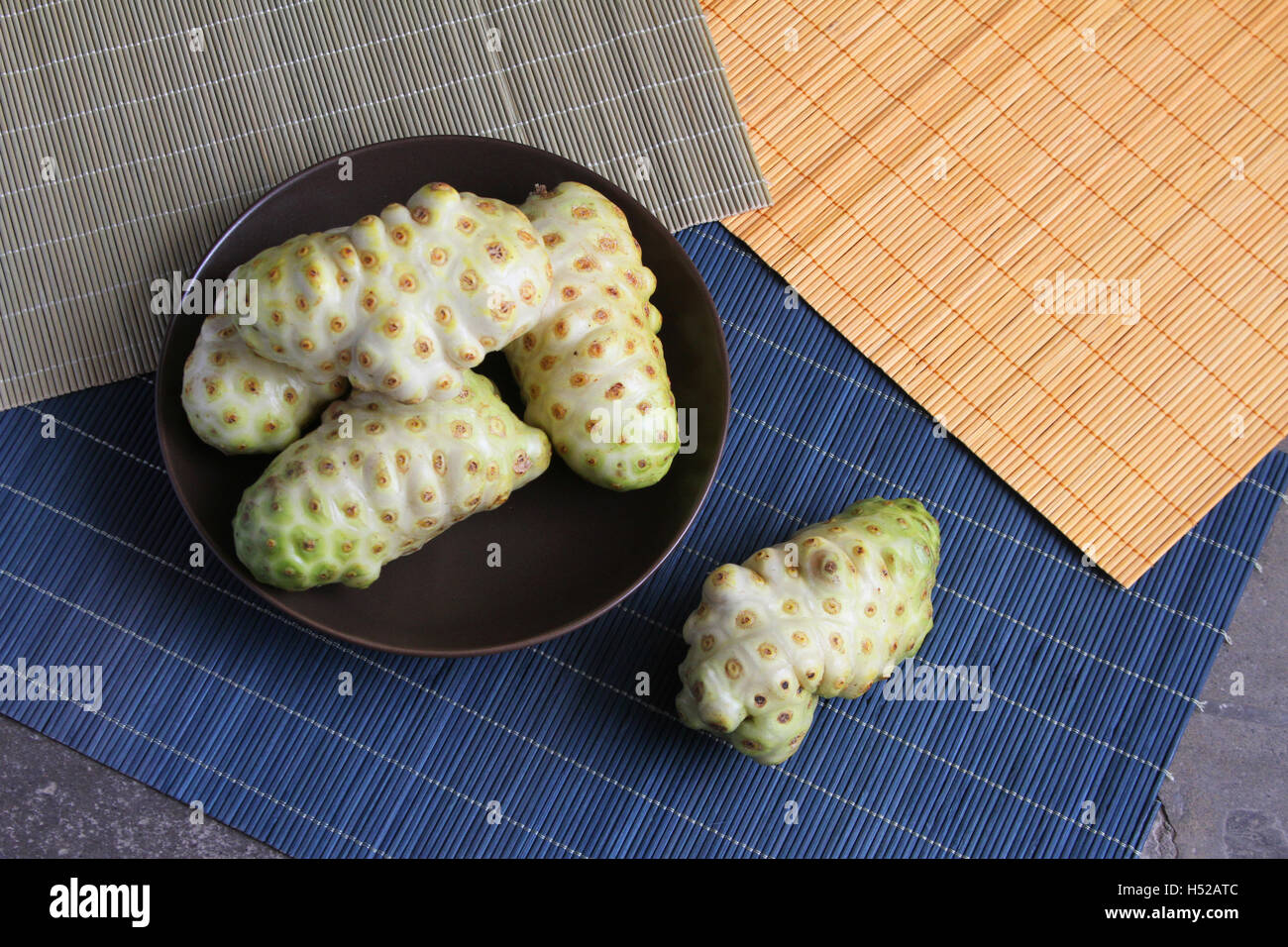 Bowl of whole, raw, Noni Fruit, Morinda Citrifolia, Indian Mulberry ...