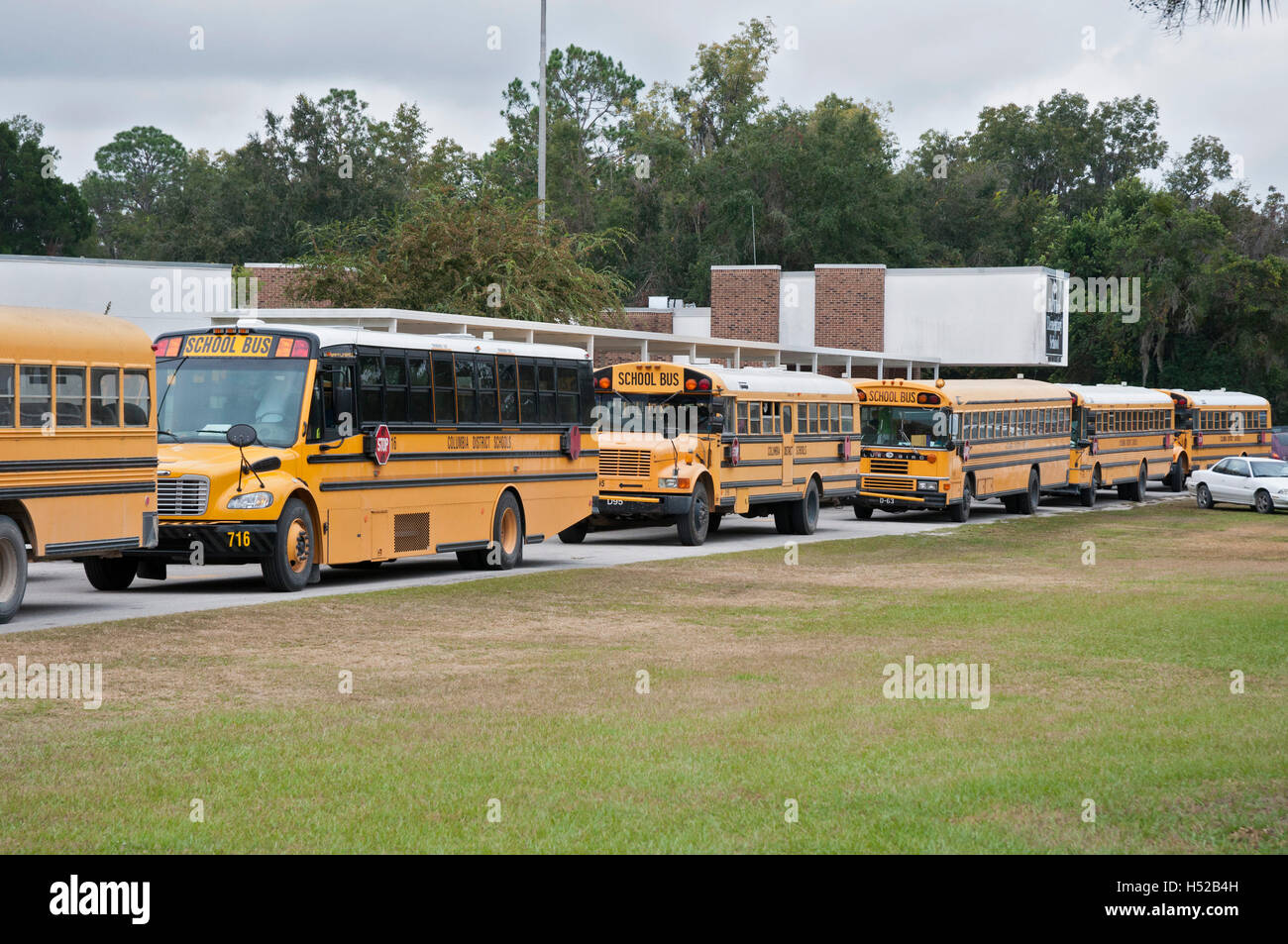 School buses lined up in front of elementary school in the small North ...