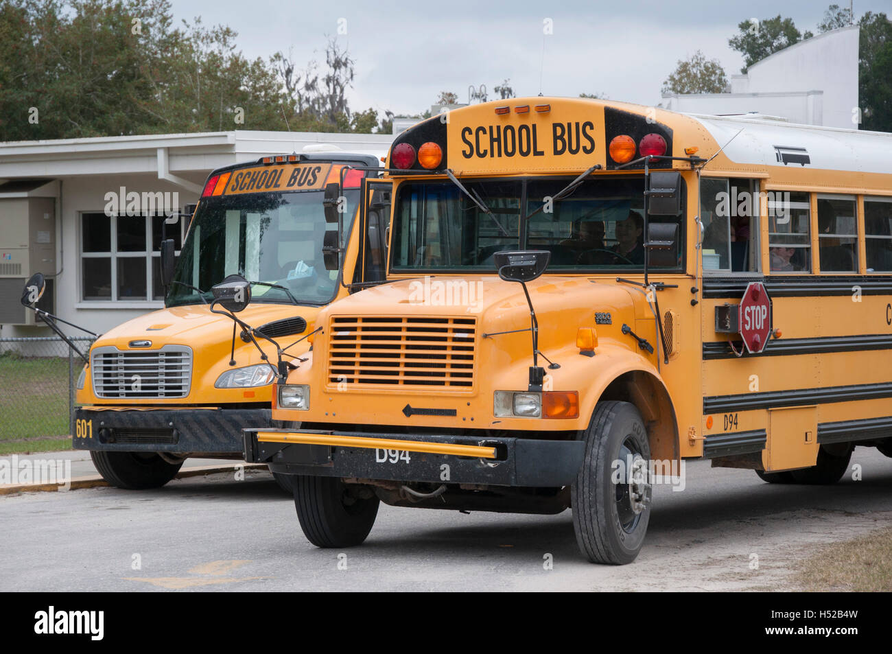 School buses lined up in front of elementary school in the small North ...
