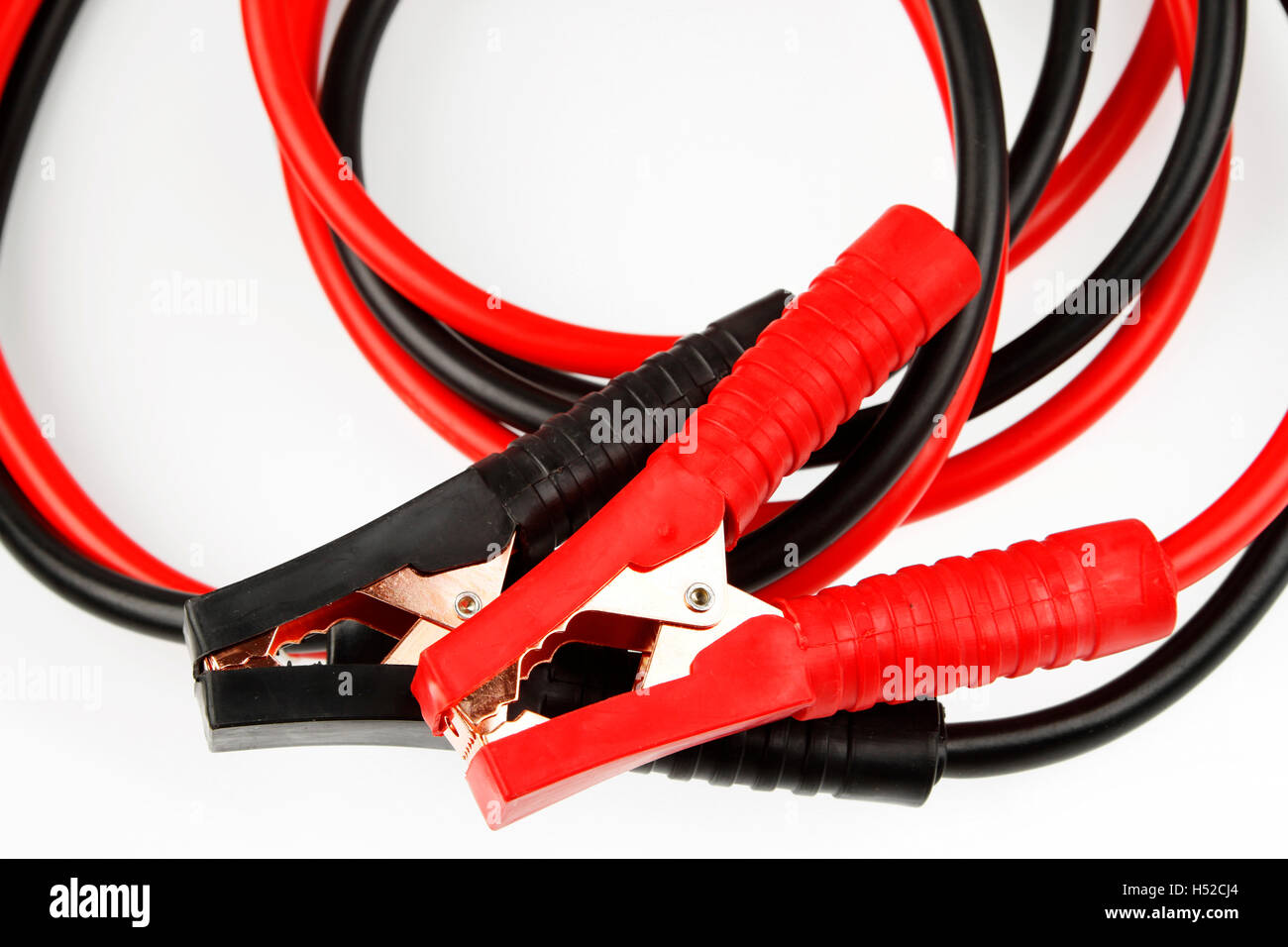 Jumper cables on plain background Stock Photo - Alamy