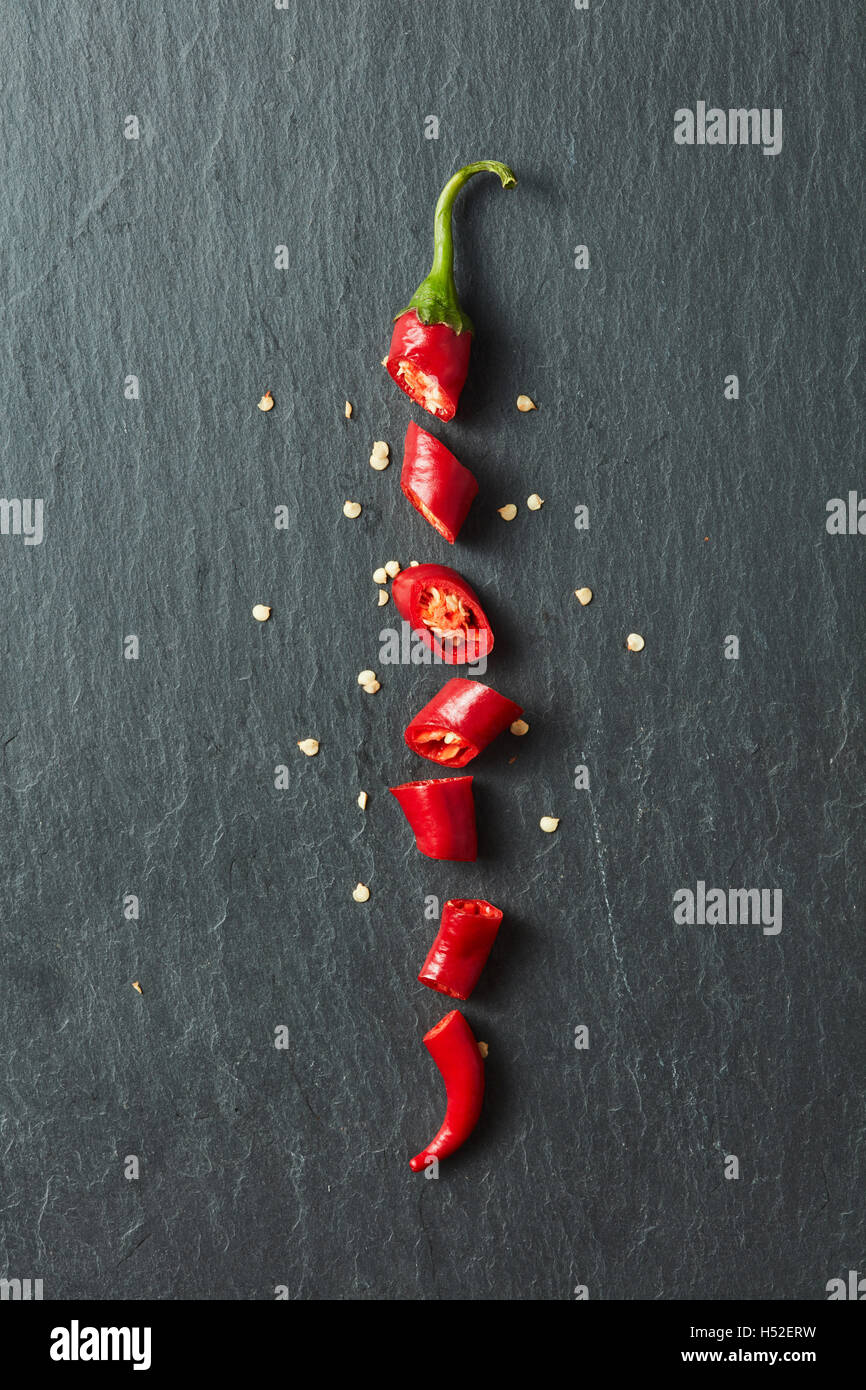 Red chili pepper cut into slices Stock Photo - Alamy