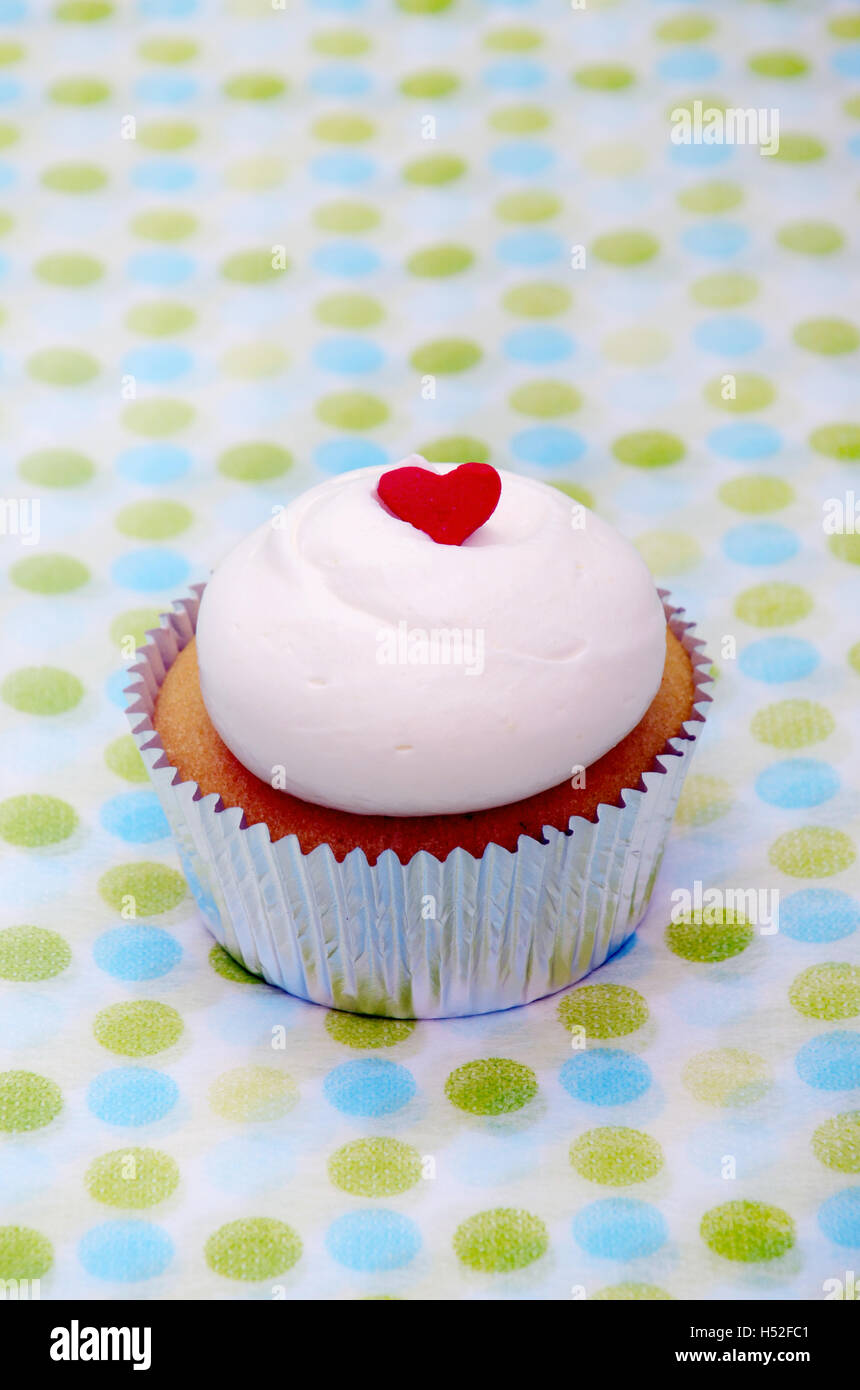 a single cup cake with symbol love ornament Stock Photo - Alamy