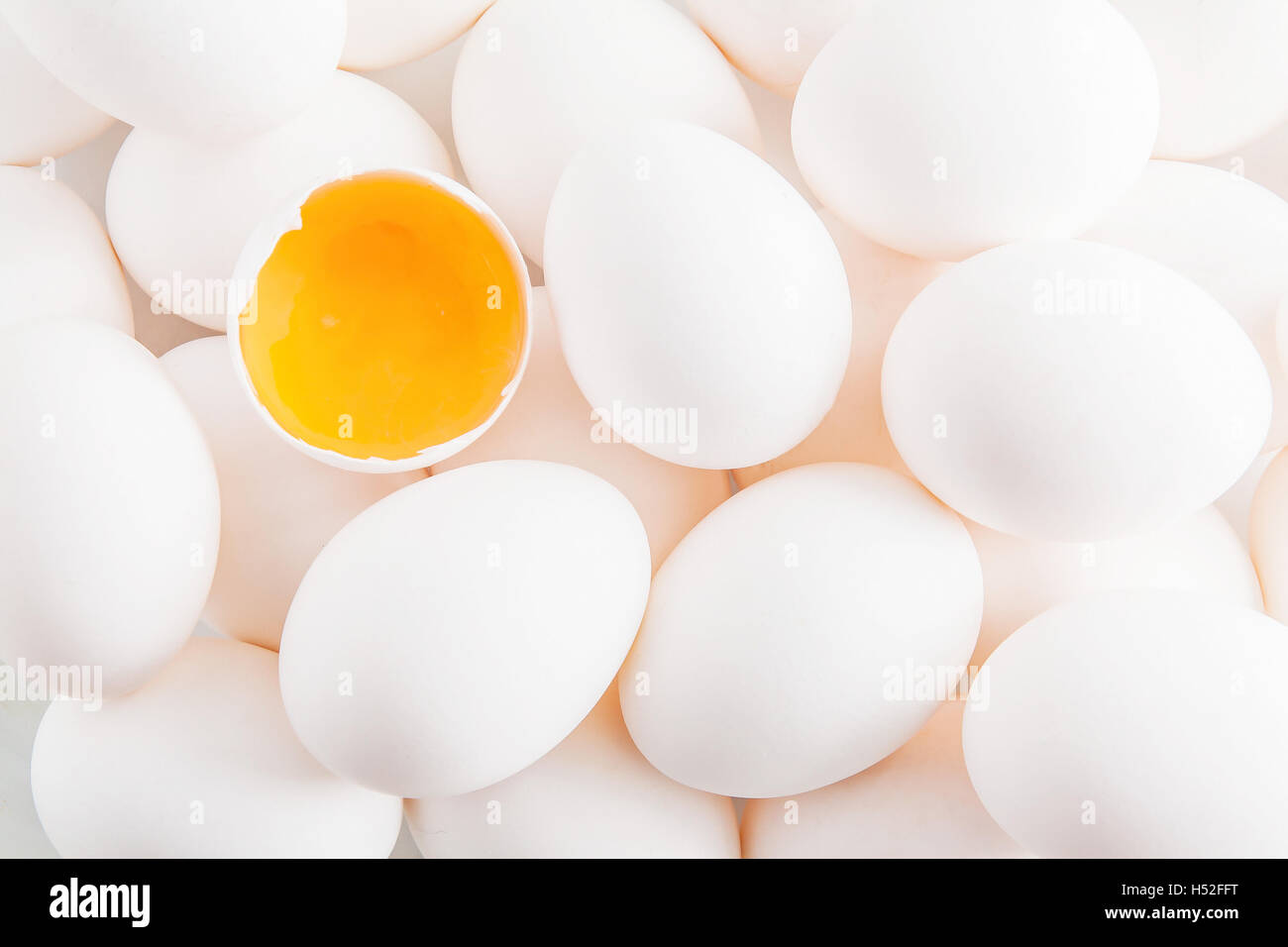 background of white chicken eggs and yolk in the shell Stock Photo - Alamy