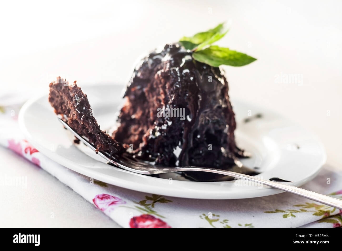 to split off from a piece of chocolate cake Stock Photo - Alamy