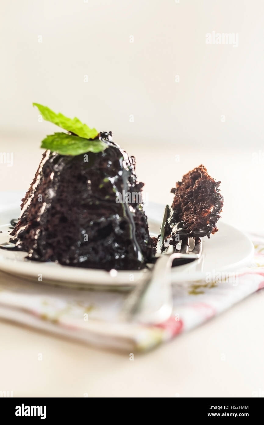 to split off from a piece of chocolate cake Stock Photo - Alamy