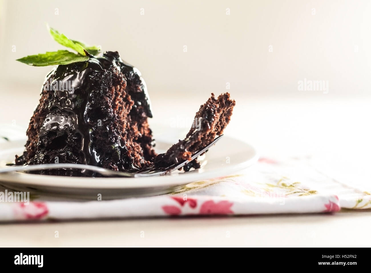 to split off from a piece of chocolate cake Stock Photo - Alamy