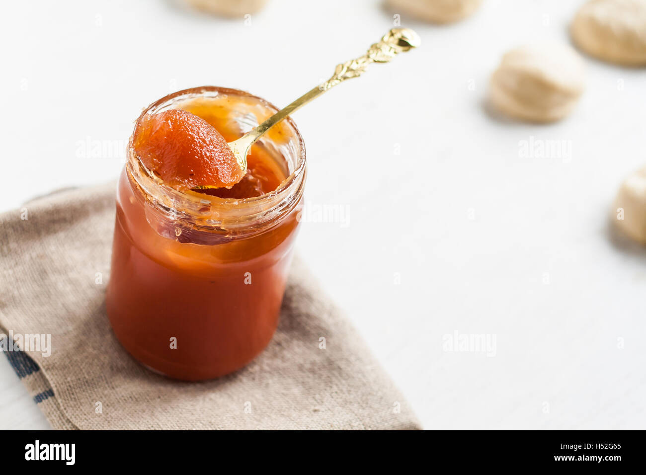 dense jam in jar spoon Stock Photo - Alamy