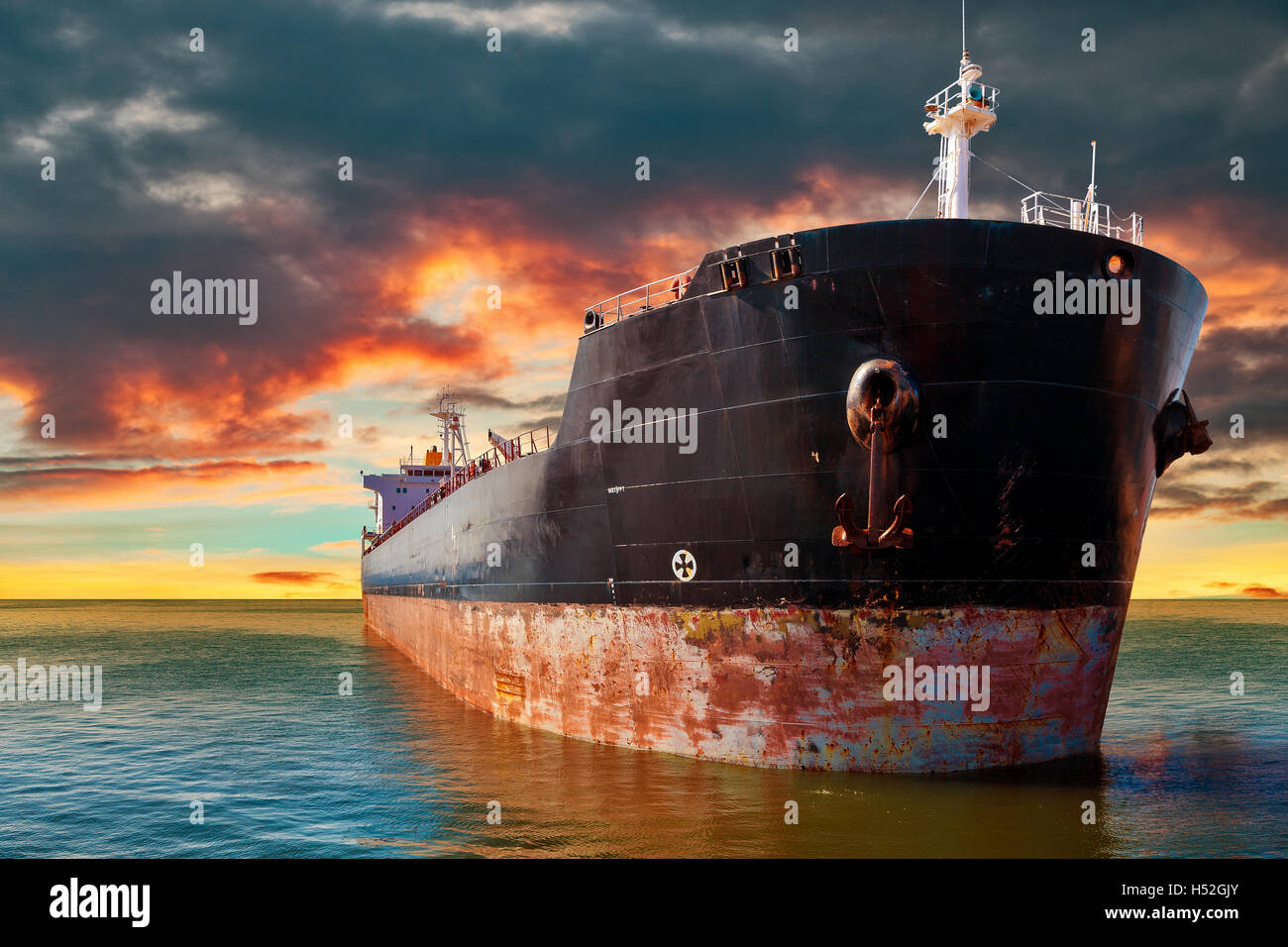 Big ship at sea on a background of sunset sky Stock Photo - Alamy
