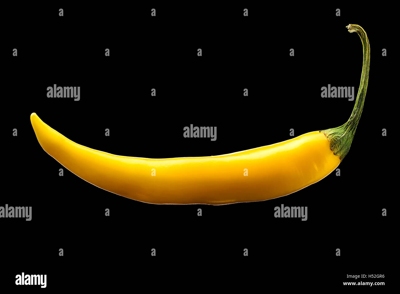Hot yellow chilli pepper isolated on black Stock Photo - Alamy